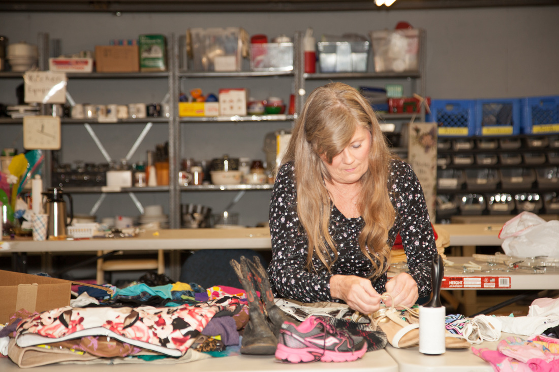 Sorting Incoming clothing donations - Neighborhood Cooperative ...